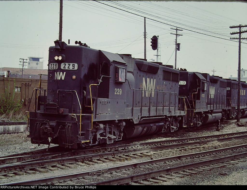 NW GP35 229 leads freight at Muncie, IN - 1980